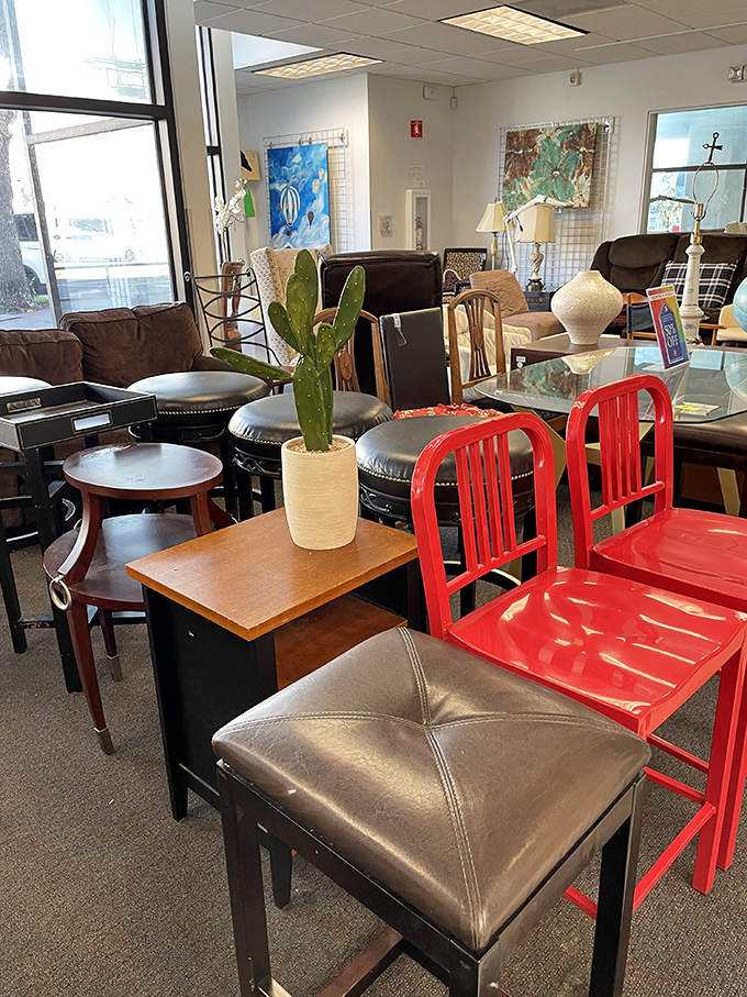 Red chairs pop against neutral furniture pieces – proof that secondhand shopping can yield design-magazine-worthy finds without the design-magazine prices.