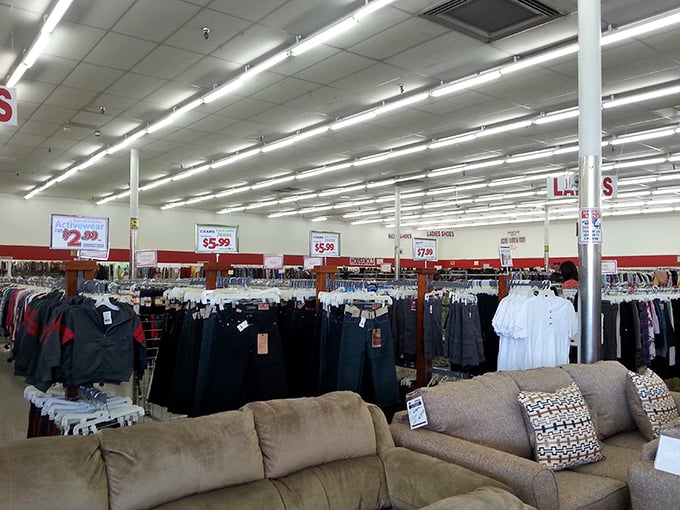 Inside, the organized chaos unfolds—racks of potential wardrobe upgrades neighbor gently-used sofas waiting for their second act.