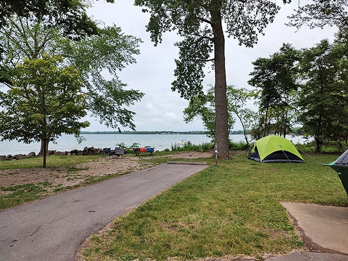 Camping with a view that beats any five-star hotel. Wake up, unzip, and boom—Lake Erie says good morning before your coffee does. 