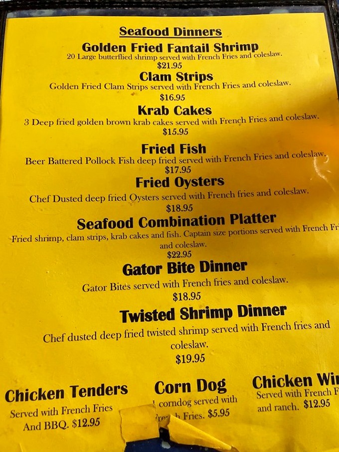 This sunshine-yellow menu is a maritime map to happiness. Each line promises another seafood adventure, from fantail shrimp to gator bites—Florida on a plate!