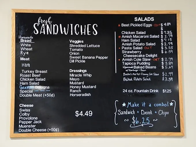 This chalkboard menu isn't just listing sandwiches and salads—it's offering a roadmap to happiness, one homemade bite at a time.