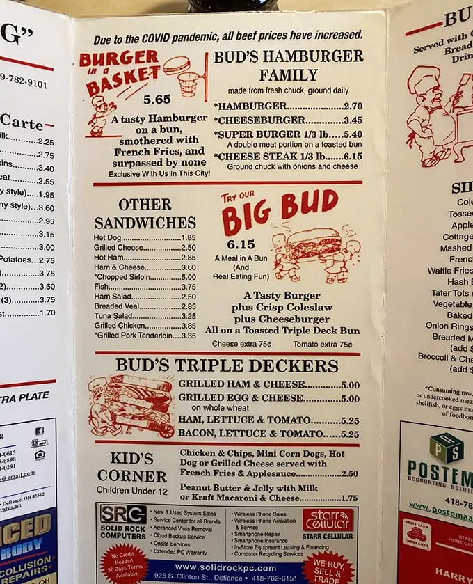 A menu that reads like comfort food poetry. No QR codes here, just laminated pages of affordable happiness that haven't needed updating in decades.