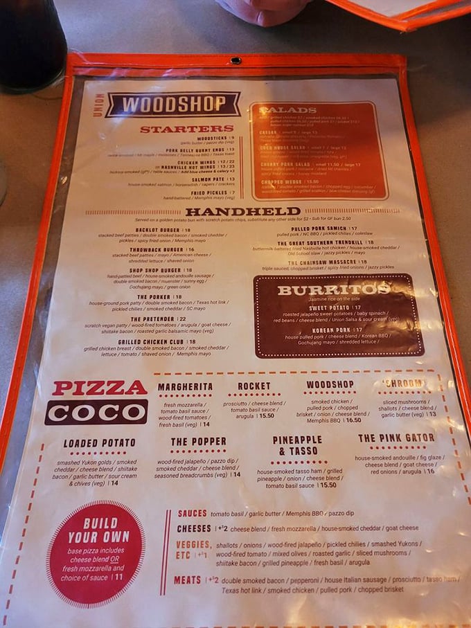 The menu reads like a love letter to American comfort food—wood-fired pizzas, handhelds, and barbecue that'll make you want to high-five the chef.