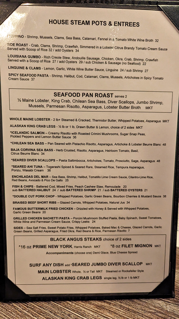 This menu isn't just reading material—it's a treasure map where X marks the spot for seafood that makes you forget you're in the desert.