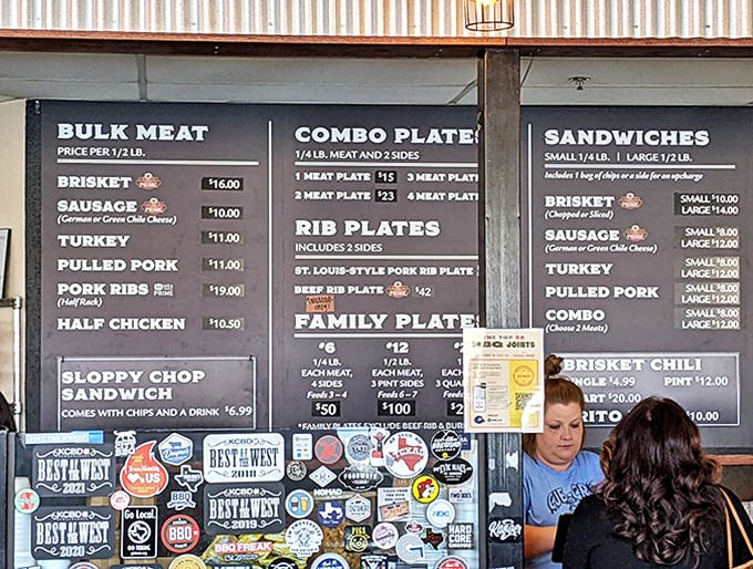 The menu board—a sacred text for carnivores—promises smoky salvation in the form of ribs, brisket, and sausage.