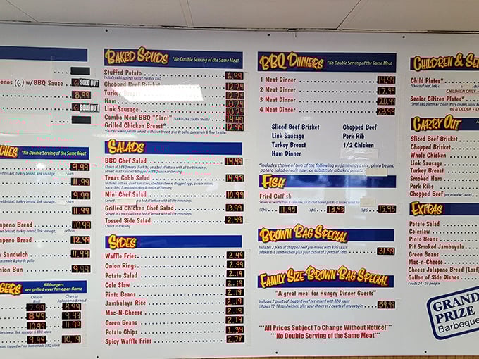 The menu board speaks the universal language of Texas—meat by the pound, plates by the appetite. No fancy fonts needed.