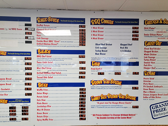 The menu board speaks the universal language of Texas—meat by the pound, plates by the appetite. No fancy fonts needed.