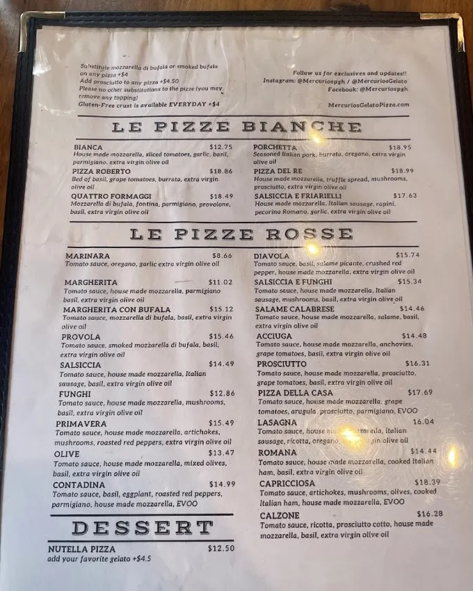 The menu reads like Italian poetry – "Le Pizze Bianche" and "Le Pizze Rosse" offering a tour of Italy's finest combinations without the airfare.