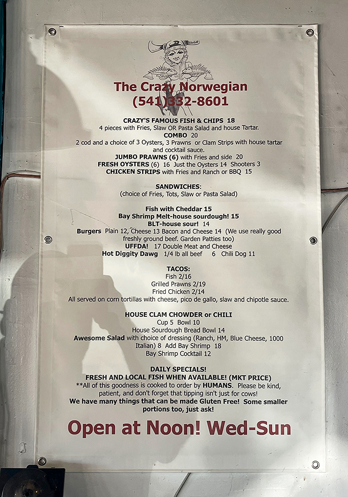 The menu reads like seafood poetry – "Crazy's Famous Fish & Chips," "House Clam Chowder," and that charming note about being cooked by actual humans.