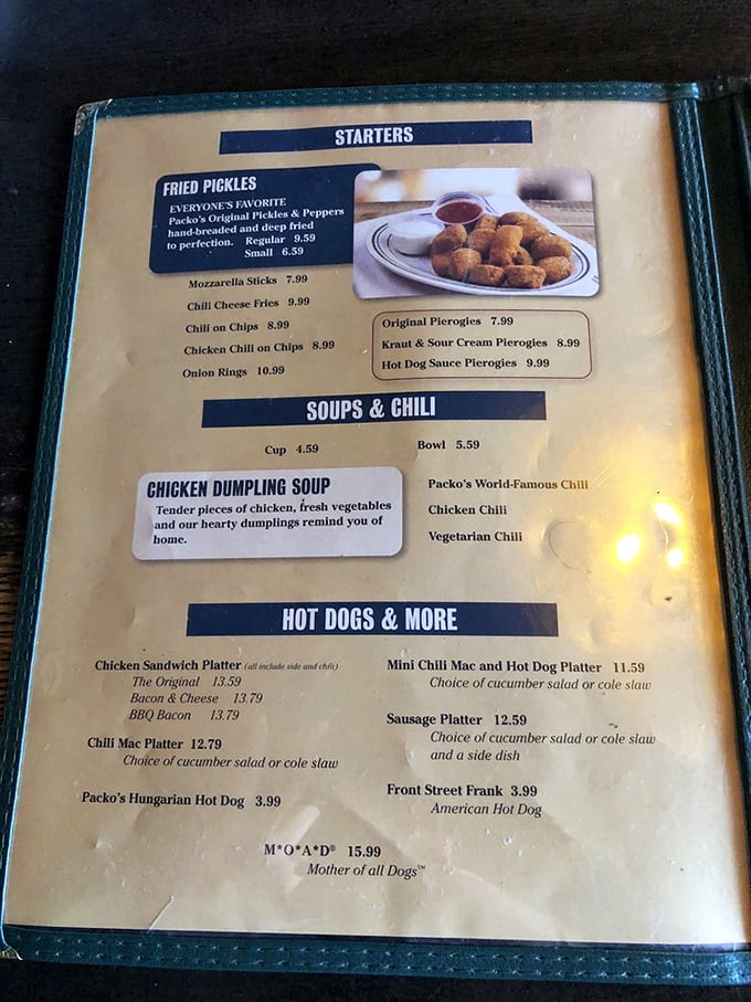 This menu isn't just a list of food—it's a roadmap to happiness. The "MOA*D" (Mother of All Dogs) isn't just clever marketing; it's a promise.