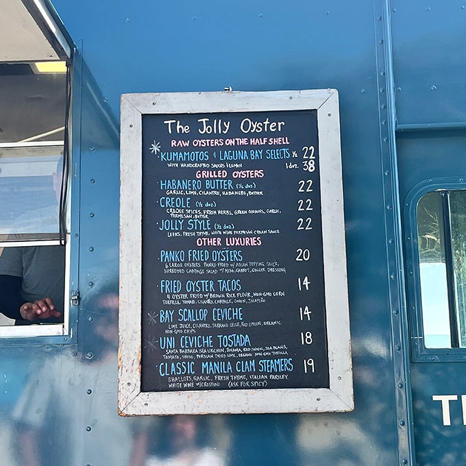A chalkboard menu that reads like poetry to seafood lovers. Each line promises a different path to briny bliss.