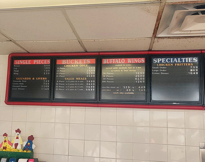 The menu board tells you everything you need to know about life's priorities: chicken first, sides second, and yes, they still serve gizzards for the true connoisseurs. 