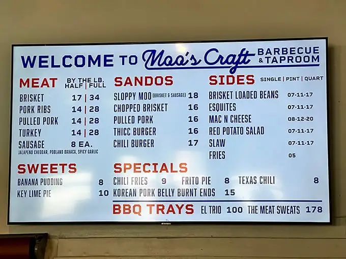 The menu board at Moo's reads like barbecue poetry – brisket, ribs, pulled pork, and sides that make choosing just one a Sophie's Choice for food lovers.