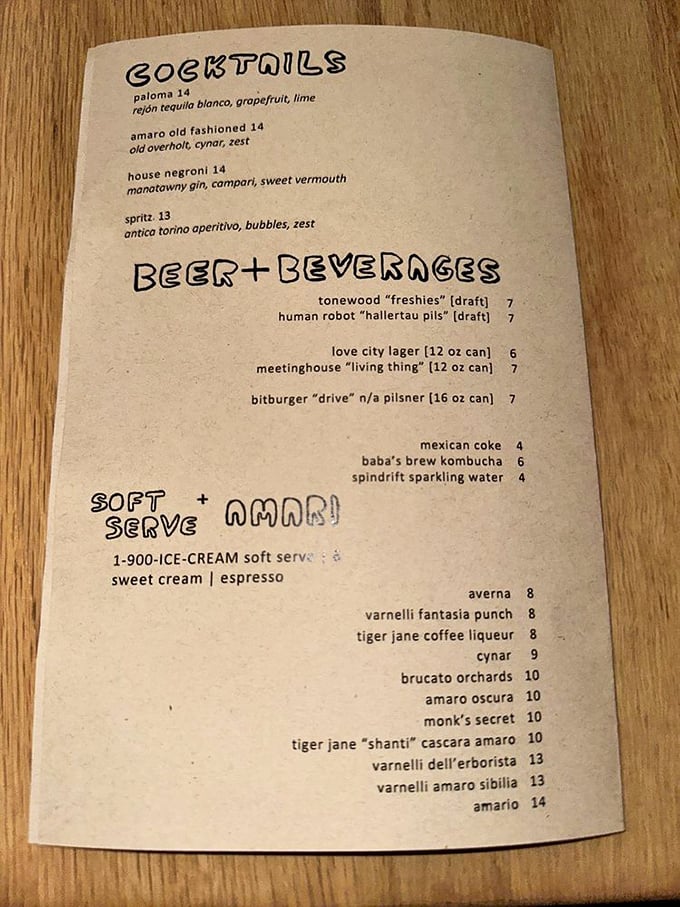 The drink menu reads like poetry for thirsty pizza lovers—craft cocktails, local beers, and that 1-900-ICE-CREAM soft serve calling your name.
