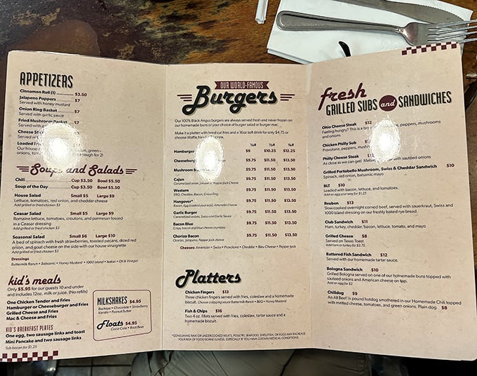 The menu reads like a love letter to American comfort food classics – burgers, sandwiches, and breakfast all day!