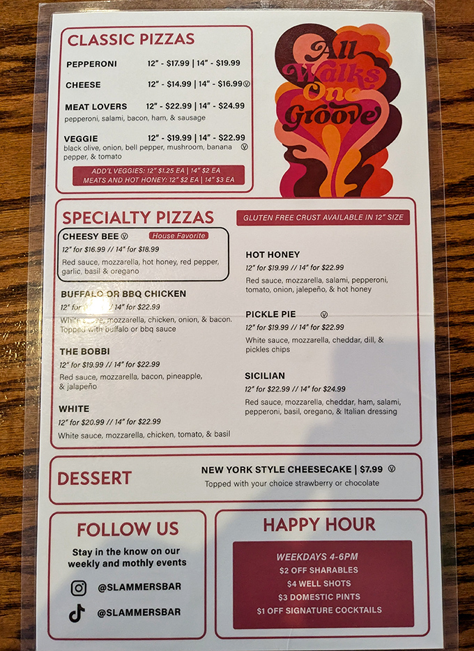 The menu tells you everything you need to know—this place takes pizza seriously but doesn't take itself too seriously. "All Walks One Groove" indeed.