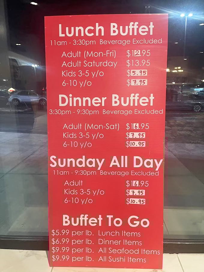 The menu board lays out the buffet's democratic approach to dining—different times, different prices, but the same access to seafood splendor for all.