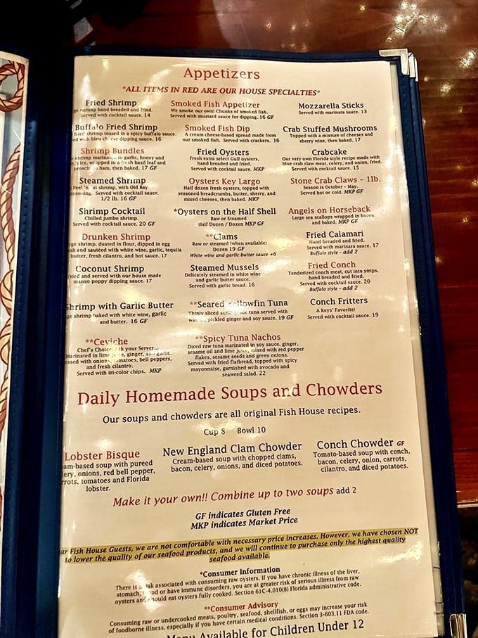 The menu reads like a love letter to the ocean, with house specialties highlighted in red—a roadmap to culinary bliss.