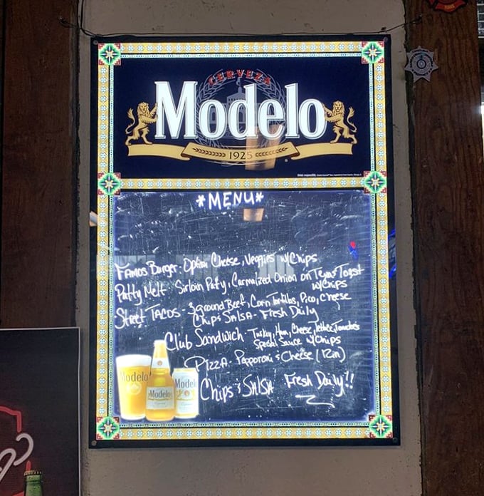 The chalkboard menu, framed by a Modelo sign, offers no pretense – just honest food that makes people drive for hours through the Hill Country.