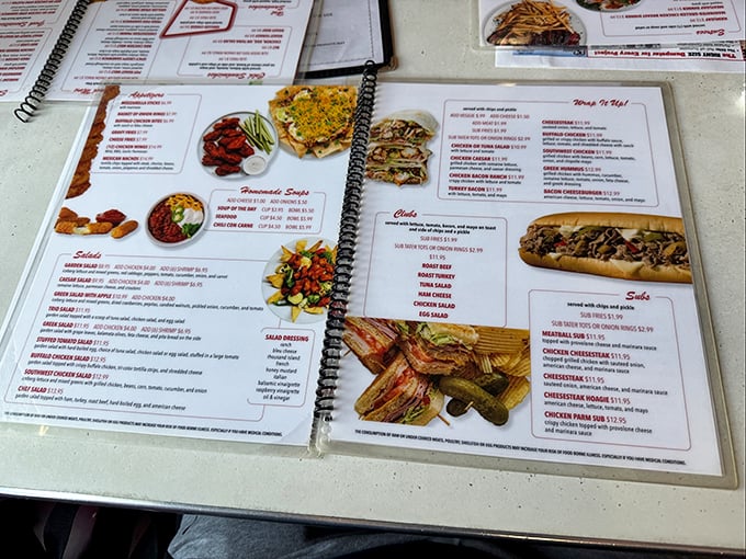 This menu isn't just reading material – it's a roadmap to happiness. Each spiral-bound page offers a different route to comfort food nirvana.