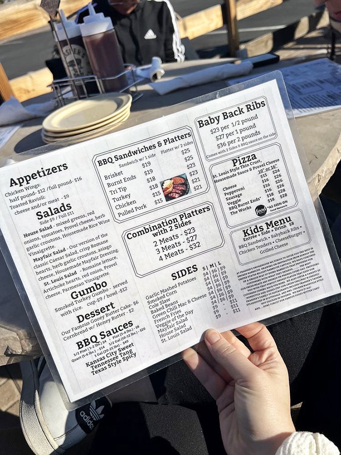 The menu reads like barbecue poetry – a love letter to regional American smoking traditions that makes decision-making deliciously difficult.