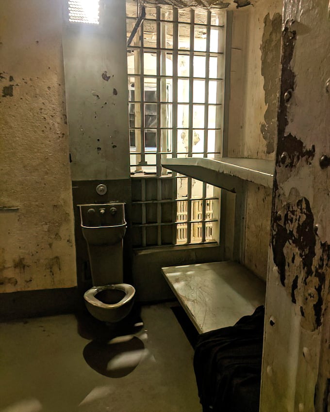 Privacy was a foreign concept here. This spartan cell offered nothing but the basics—a metal bed, institutional toilet, and the constant reminder that freedom was just beyond those bars.