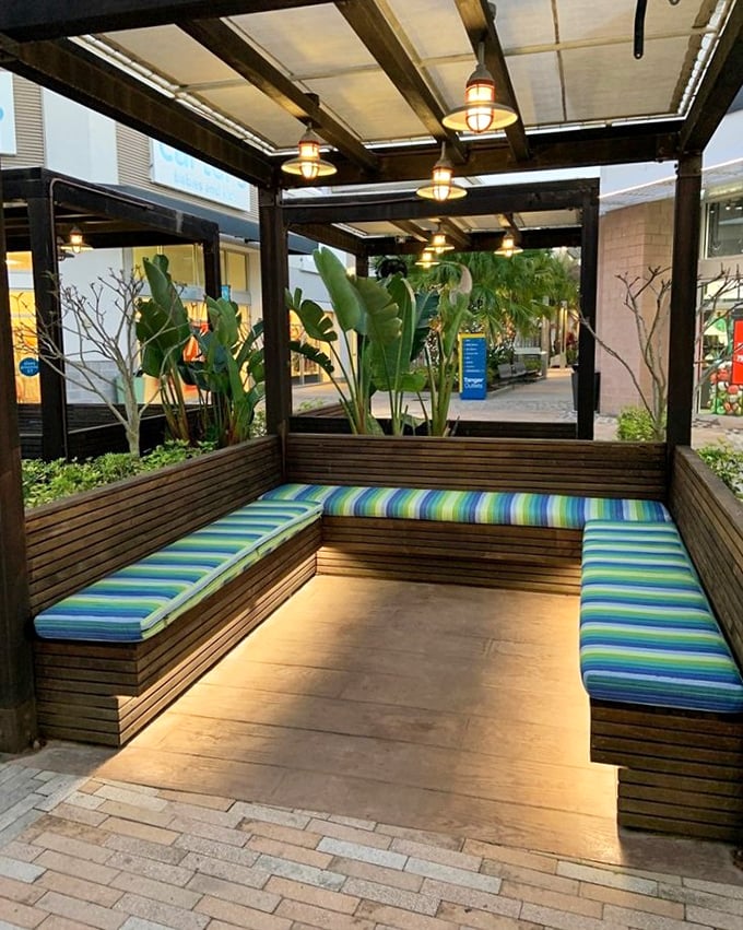 Covered seating areas with tropical touches – because even bargain hunters need their moment of zen.
