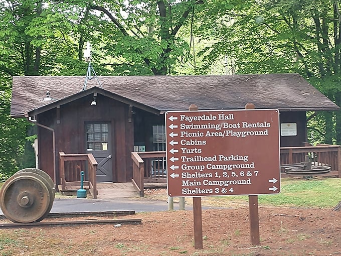 This rustic information center doesn't just point you in the right direction—it practically whispers "adventure this way" with its weathered charm.
