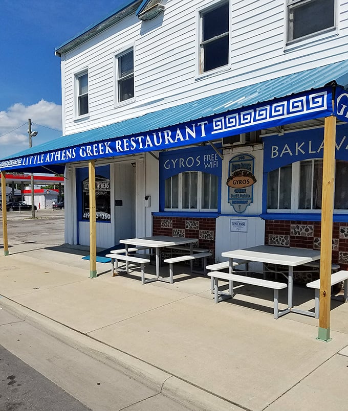 Little Athens Greek Restaurant brings Mediterranean flavors to the heartland with its vibrant blue awning promising gyros, baklava, and the modern necessity—free WiFi.
