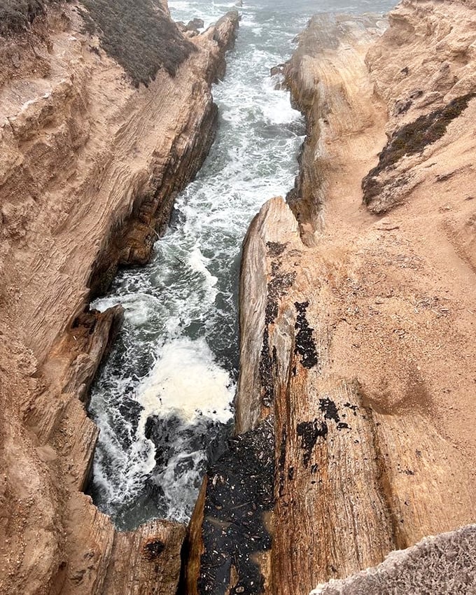 Nature's own Grand Canyon in miniature. The Pacific has carved this stunning channel with the patience only water can afford—one wave at a time.