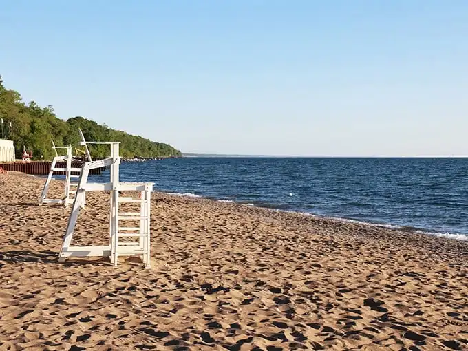 That iconic white pier stretches toward Michigan like a concrete runway for your thoughts. Find your zen at the end, where nothing stands between you and the vastness of Great Lakes majesty.