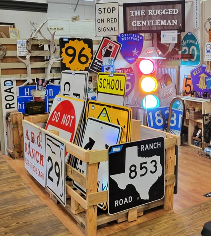 Road sign heaven! This collection would make any man-cave decorator weak in the knees—that working traffic light is practically begging for a home.