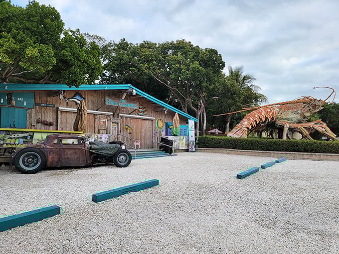 The weathered charm of Rain Barrel Village pairs perfectly with its giant lobster guardian, like a quirky Florida Keys buddy comedy waiting to happen.