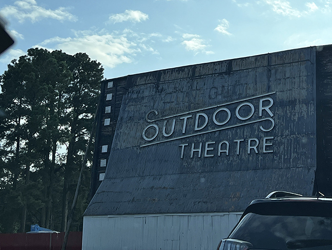Film history written in weathered metal and wood—this massive screen has witnessed countless first dates, family outings, and summer memories.