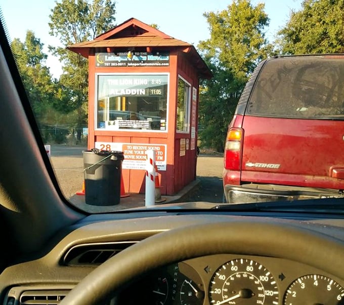 The little red ticket booth—cinema's gatekeeper where excitement begins and memories are stamped. No digital QR codes here, just genuine human interaction.