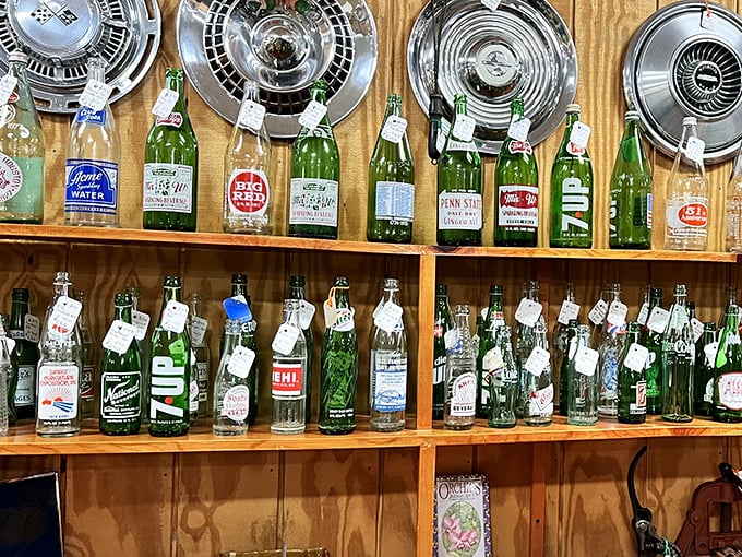 A liquid time capsule—these vintage bottles line up like soldiers from bygone eras, each one whispering stories of soda fountains and corner drugstores.