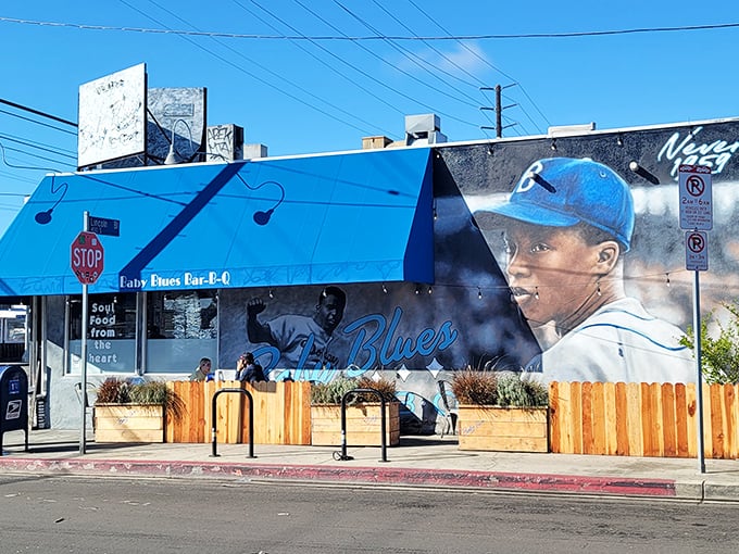 That stunning mural isn't just street art – it's a delicious promise of the blues-inspired BBQ waiting inside.