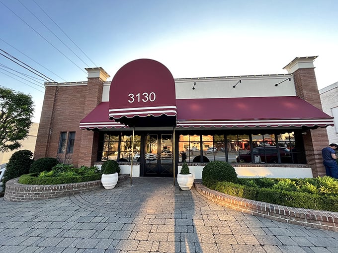 Bones Restaurant's burgundy awning stands like a royal banner announcing "Serious steak territory ahead!"
