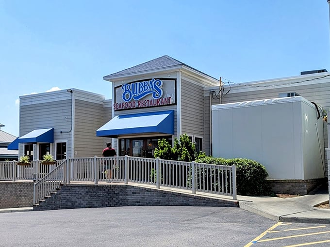 Bubba's clean white exterior and blue awnings whisper "seafood joint," but locals know it screams "get the crab cakes!" Trust me on this one.