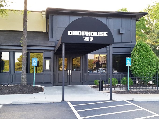 That sleek black awning beckons like a beacon for steak lovers seeking their next great meal.