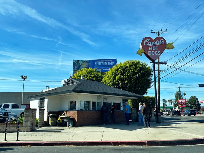 That vintage neon sign has been guiding hungry hearts to hot dog heaven for generations.