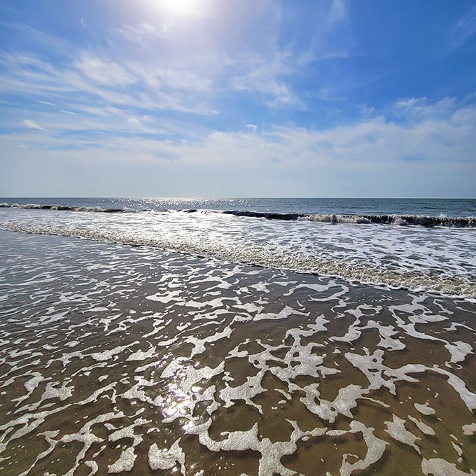 Ocean lace! Edisto's foamy shoreline creates nature's most exquisite doily pattern—better than anything your grandmother ever crocheted.