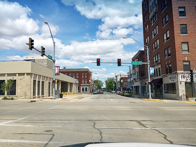 Stoplights over wide streets remind you: not every great meal rushes, some demand a pause first.