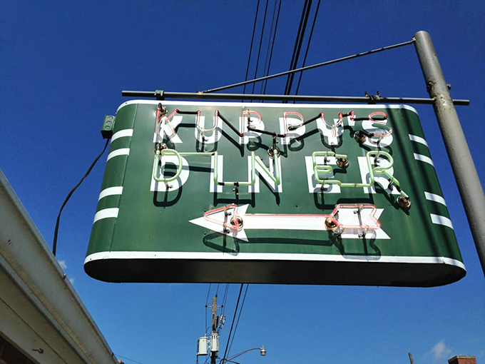 Kuppy's vintage green sign with that confident arrow points the way to small-town diner perfection. Follow it for hash brown heaven!