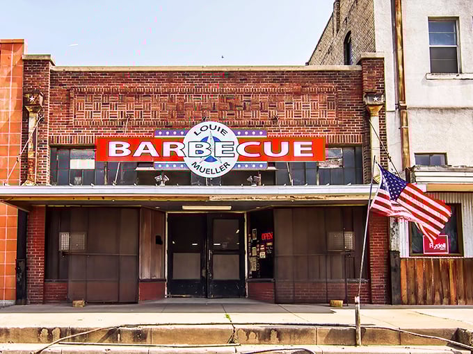 Louie Mueller's brick façade and bold sign have welcomed BBQ pilgrims to Taylor for generations—a meaty Mecca in plain sight.
