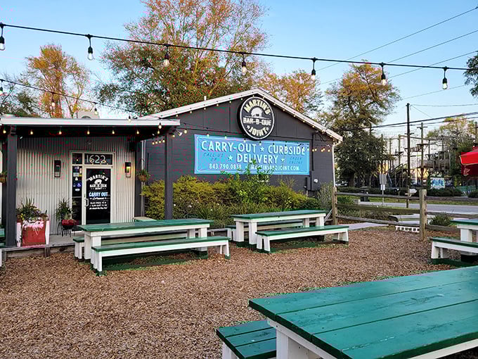 Martin's Bar-B-Que Joint's outdoor picnic tables await under string lights – dinner and a show of stars.