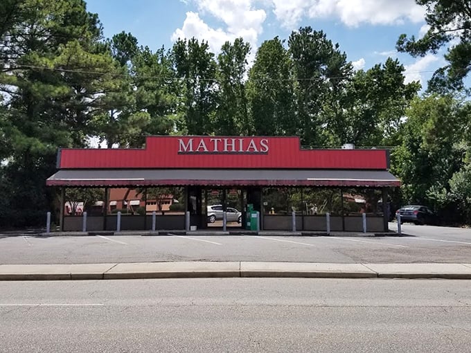 That classic red awning signals sandwich territory ahead – no frills, no fuss, just pure deliciousness between bread.