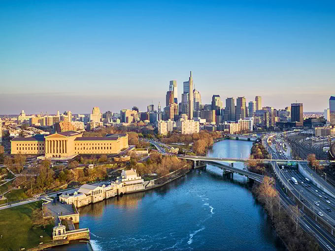 Philadelphia's skyline rises from the Delaware like America's greatest architectural symphony in motion.