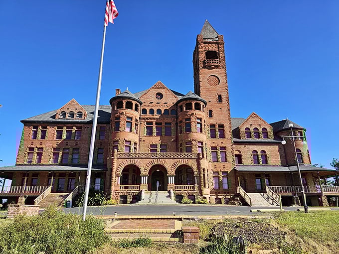 Red brick and Romanesque arches create a castle that looks like it stepped out of European history books.