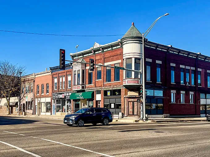 Brick storefronts line up like old friends, each one holding decades of neighborhood memories.